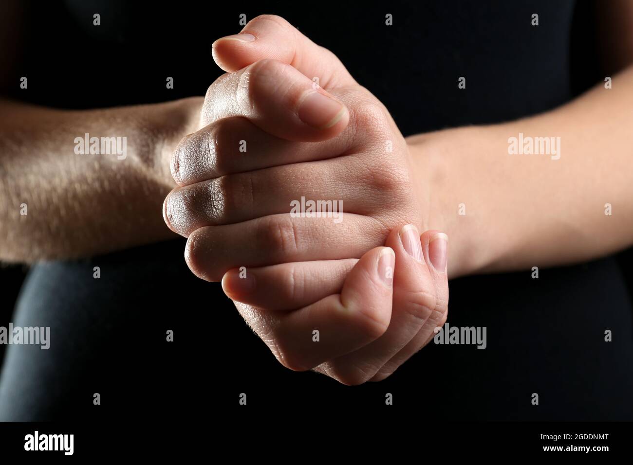 Human hands on black background Stock Photo - Alamy