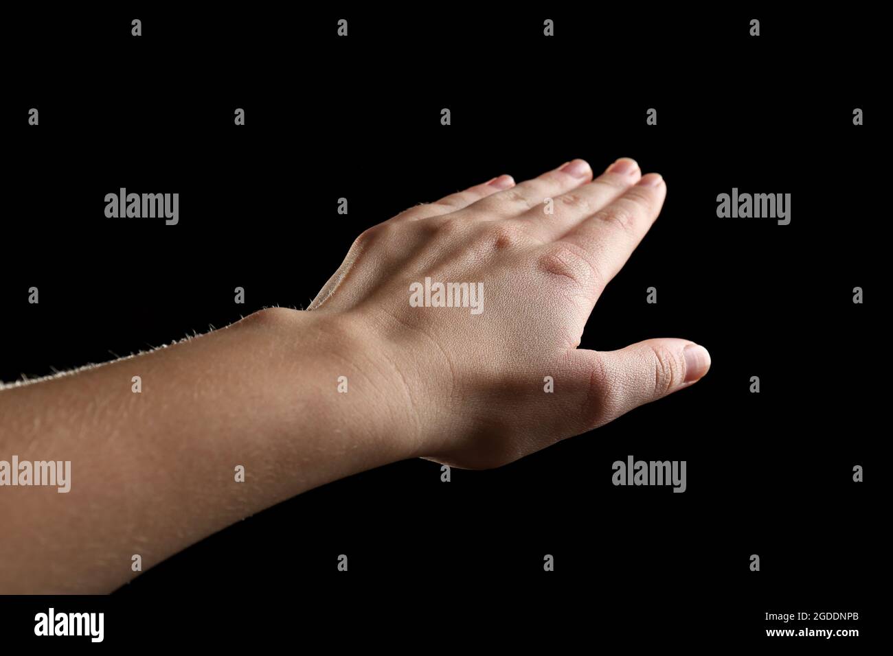 Human hand on black background Stock Photo - Alamy