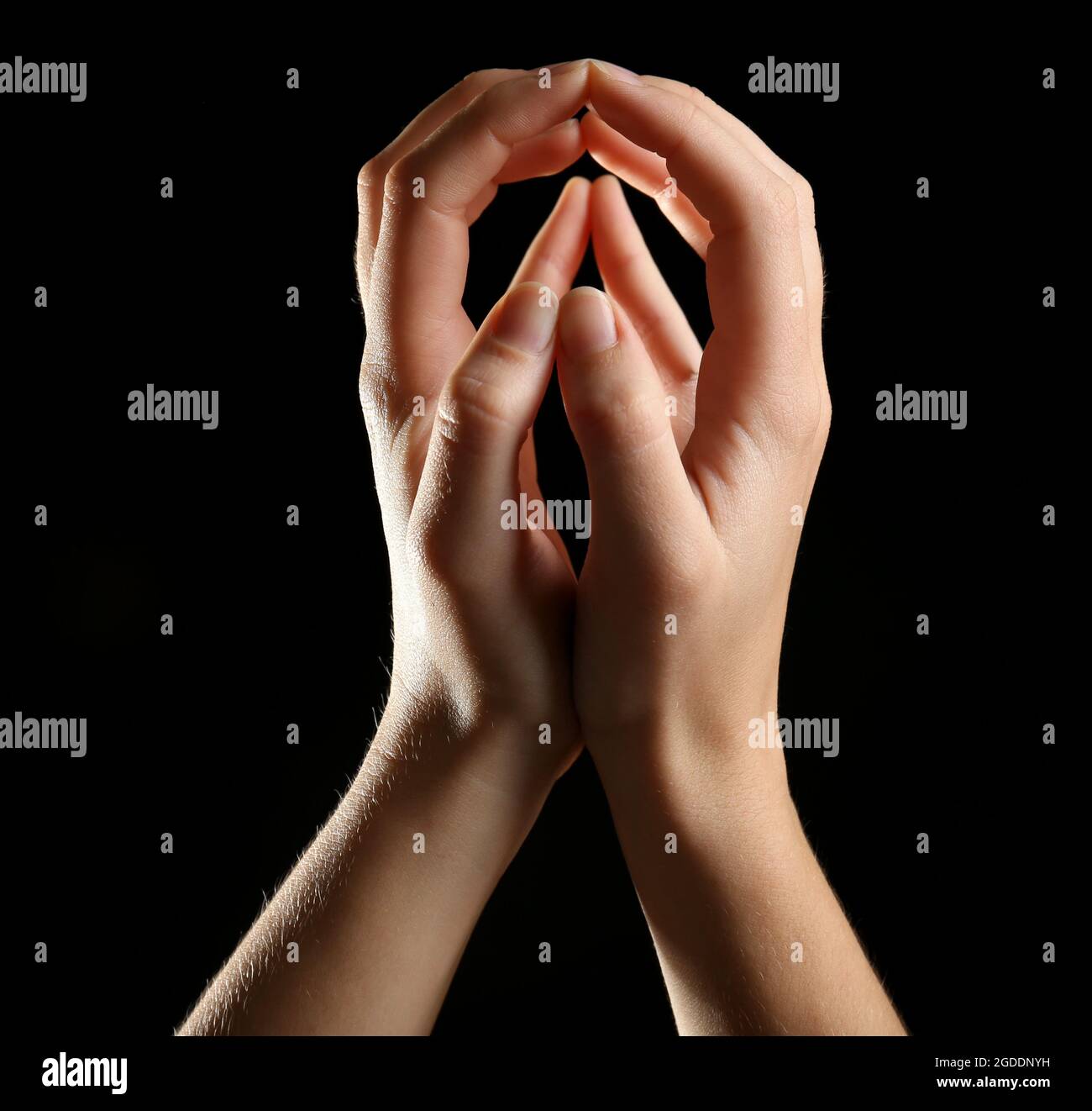 Human hands on black background Stock Photo - Alamy