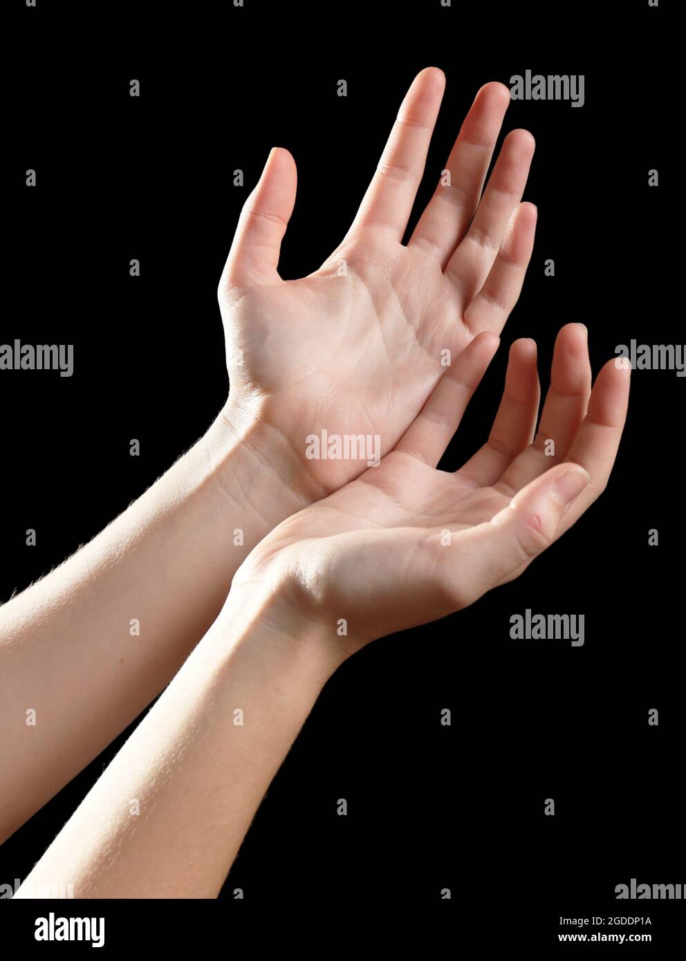 Human hands on black background Stock Photo - Alamy