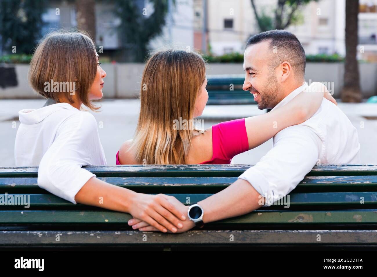 Image of the love triangle between young people outdoor Stock Photo - Alamy