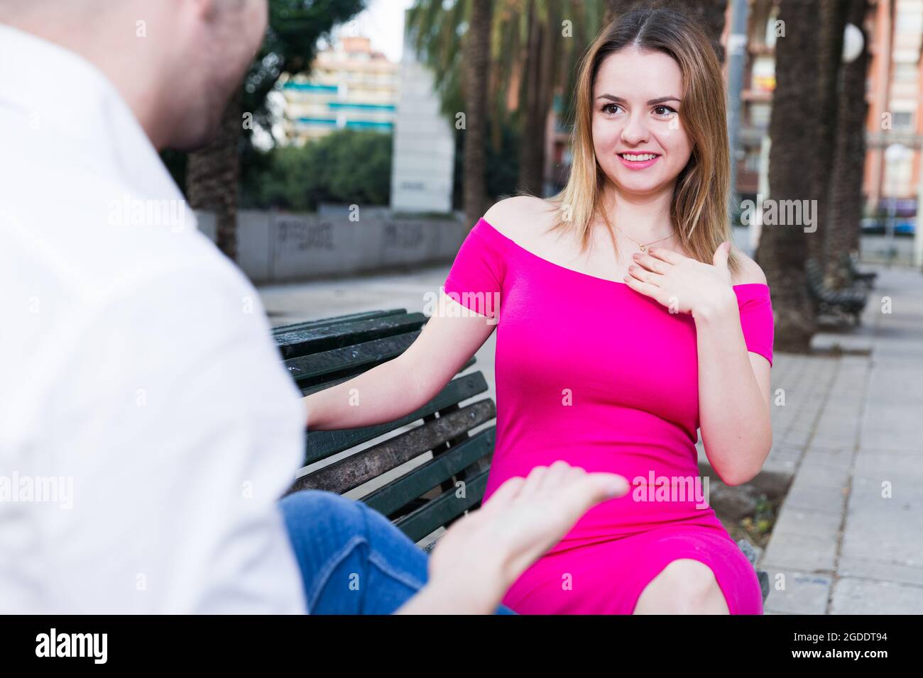 Young woman is playful talking with stranger man Stock Photo - Alamy