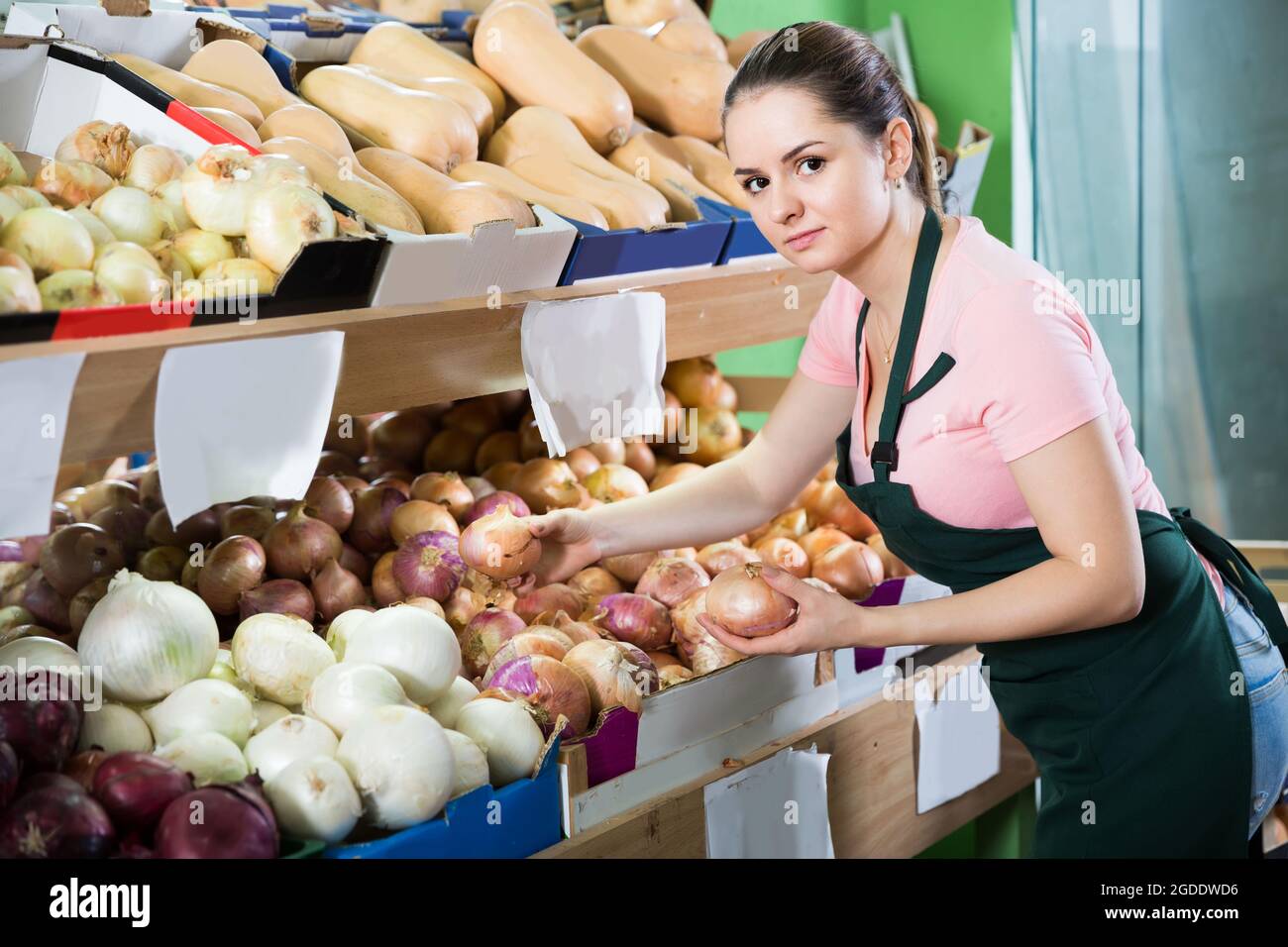 Worker arranging produce in supermarket hi-res stock photography and ...