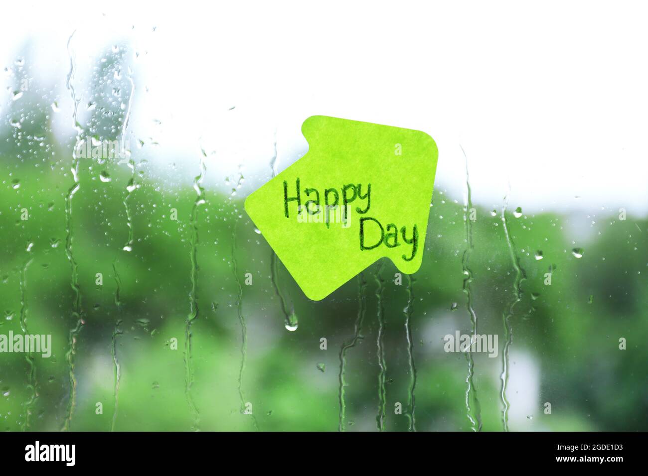 Sticker on wet window Stock Photo - Alamy