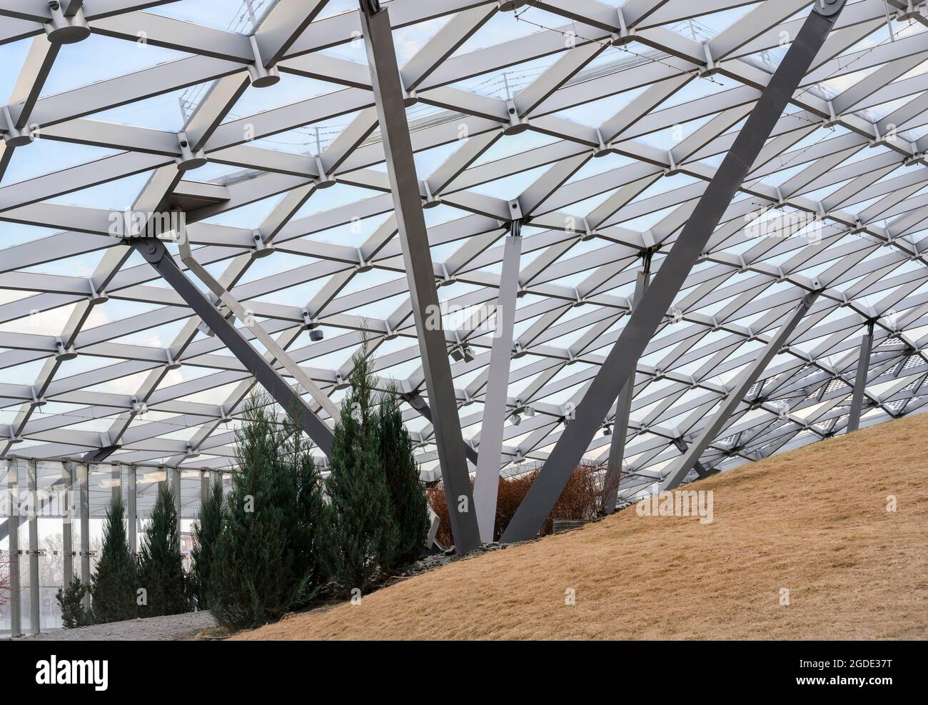 Spherical dome with metal trusses over Zaryadye park with trees in ...