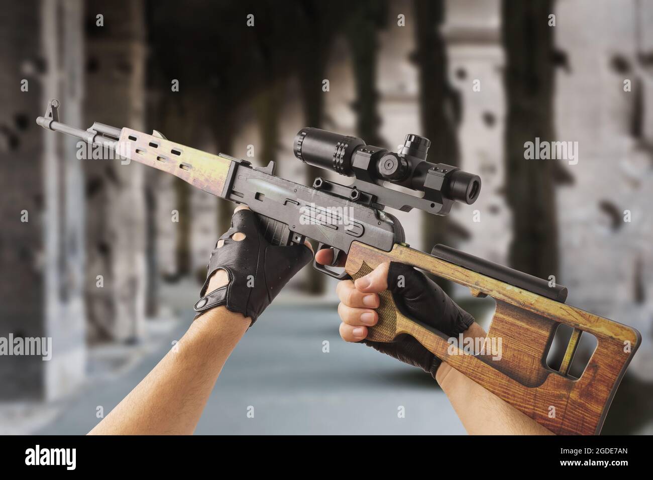 Wooden toy sniper rifle made of wood in hands Stock Photo - Alamy