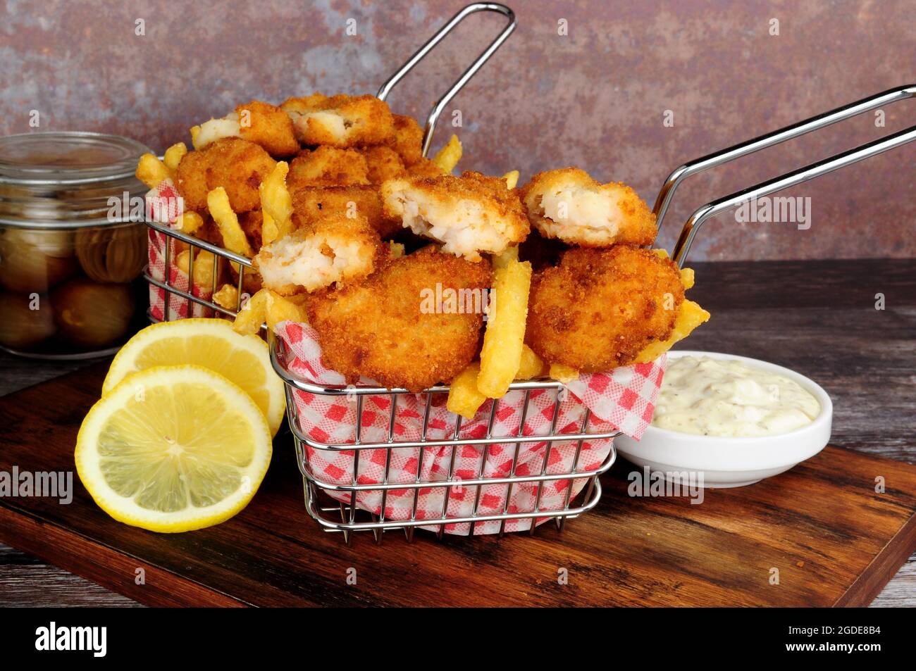 Scampi and French fries meal in wire serving baskets with tartar sauce ...