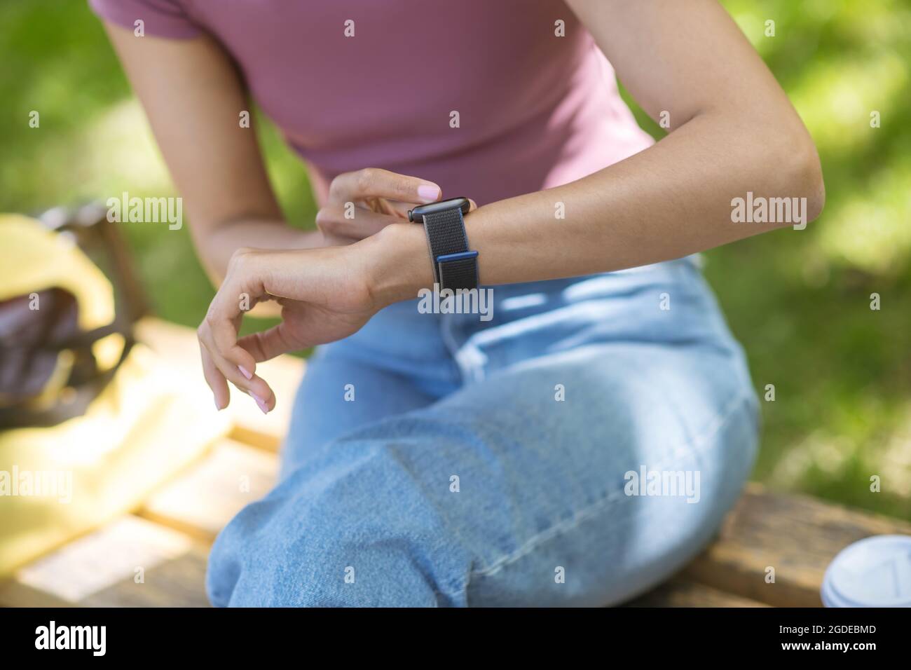 A girl with a smartwatch on her wrist Stock Photo - Alamy