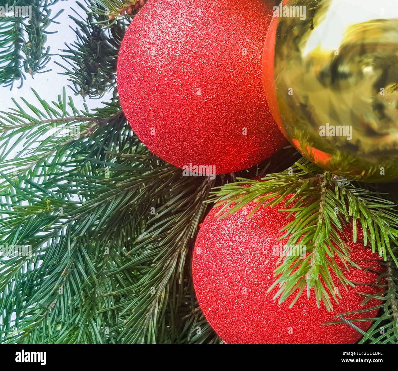 Gold and red Christmas balls on the Christmas tree close-up. Decorating ...