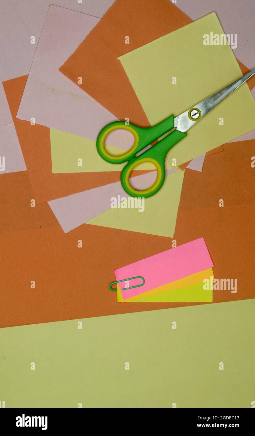 Color paper and scissors lying on table. DIY Paper Crafts cutting and ...