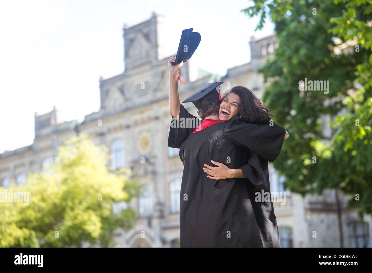 Graduation cap excited friends hi-res stock photography and images - Alamy