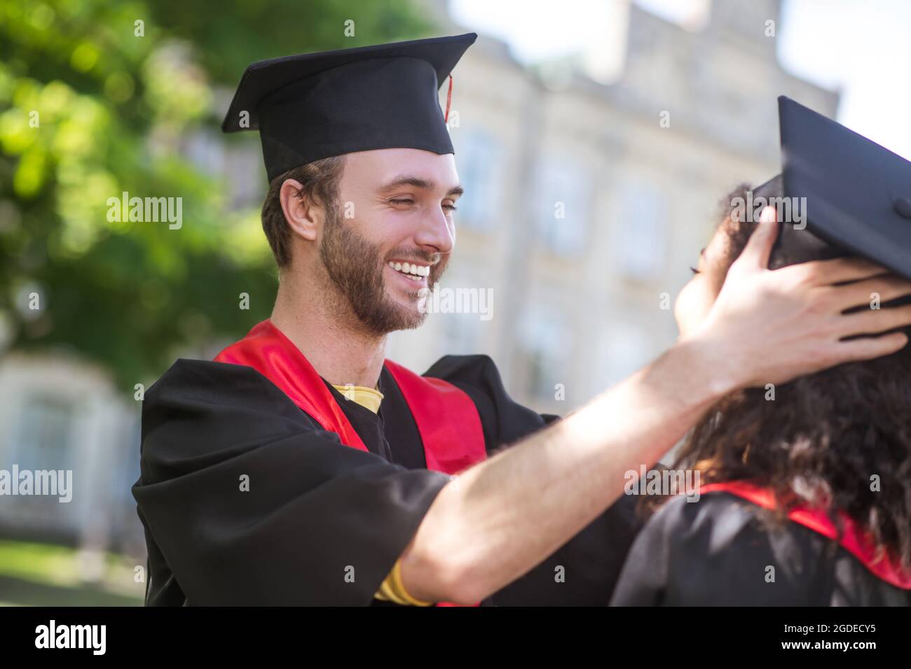 Two graduates feeling excited after graduation and looking happy Stock ...