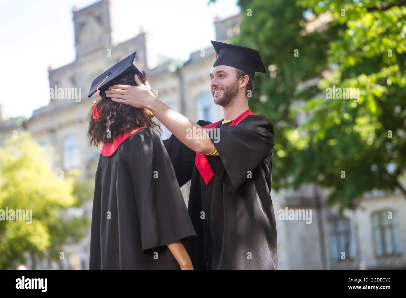 Two graduates feeling excited after graduation and looking happy Stock ...