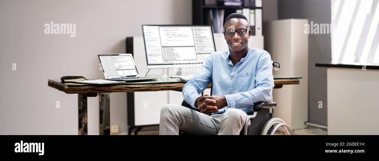 African American In Wheelchair Using Computer. Handicapped Developer ...