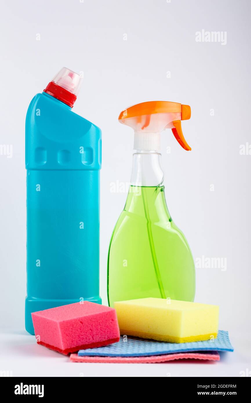 Sprayer with rags and sponge for cleaning on white background. The ...