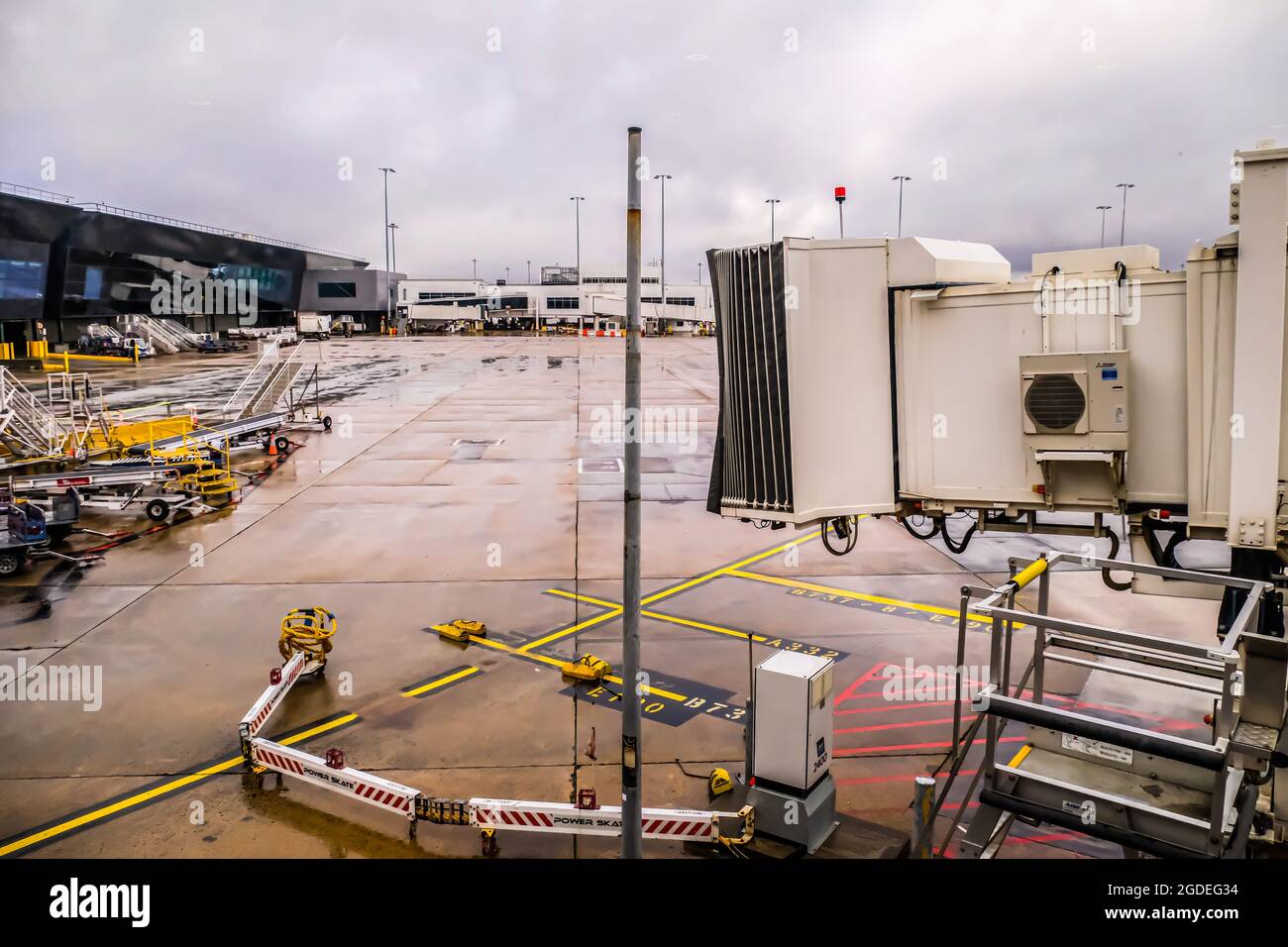 A view of an empty airport tarmac with a docking bridge at the domestic ...
