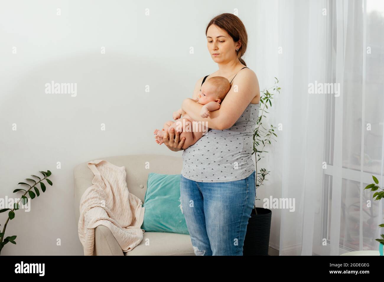 Normal situation for mother to be tired of child upbringing Stock Photo ...