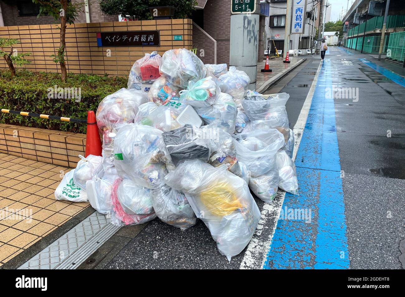 Tokyo, Japan. 09th Aug, 2021. Bags full of plastic garbage are on the ...