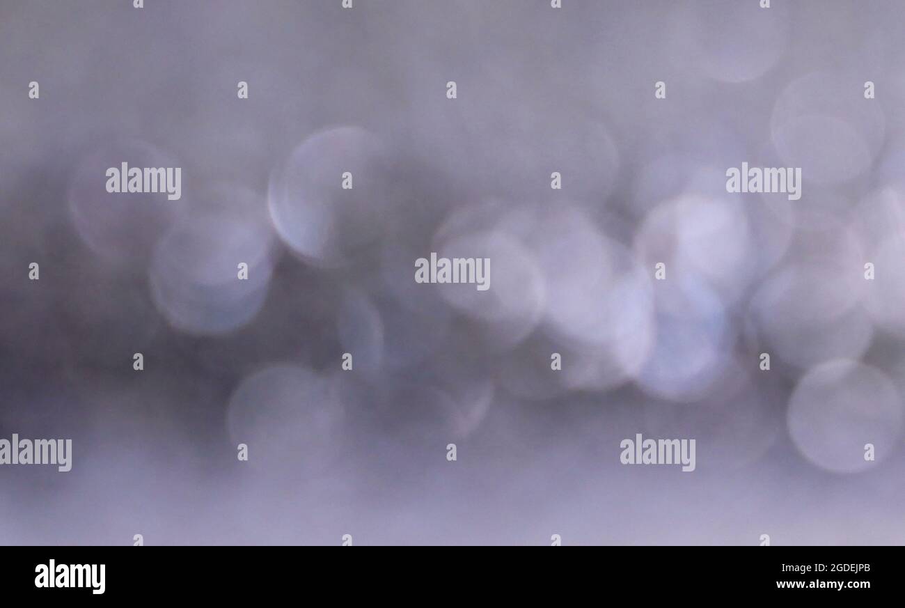 Soft grey blue grainy blurred abstract background with space for copy ...