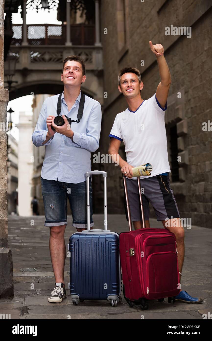 Smiling two tourists luggage standing hi-res stock photography and ...
