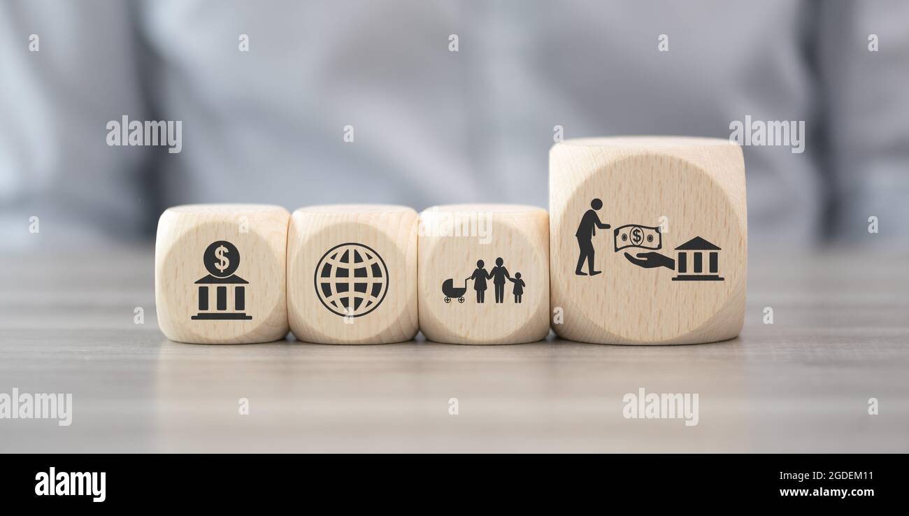 Wooden blocks with symbol of government aid concept Stock Photo - Alamy
