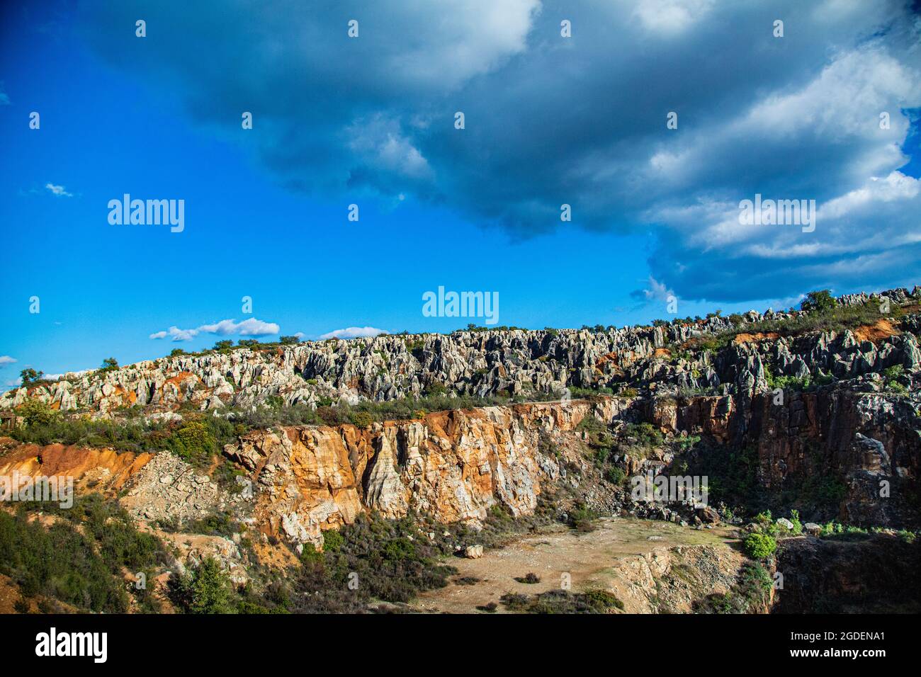 Natural park of eroded stone and red sand forest, with abandoned iron ...