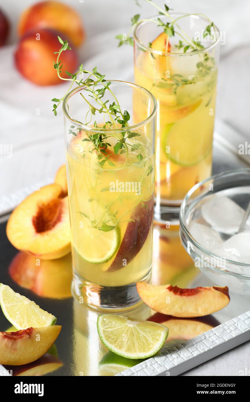 Peach summer cocktail. Refreshing organic non-alcoholic drink, lemonade ...