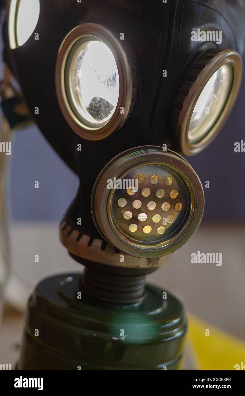 Abstract composition with a gas mask glowing from inside. Military gas ...