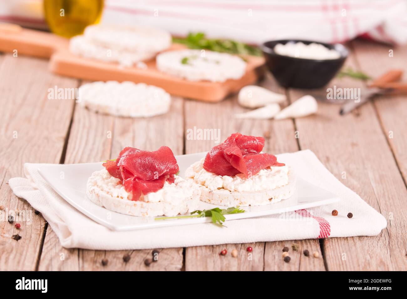 Rice cakes with milk flakes and cold beef Stock Photo - Alamy