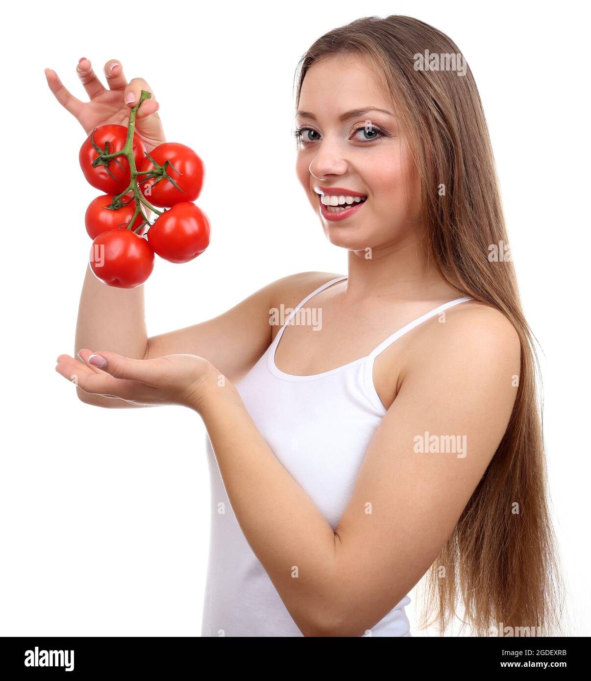 Beautiful girl with tomato, isolated on white Stock Photo - Alamy