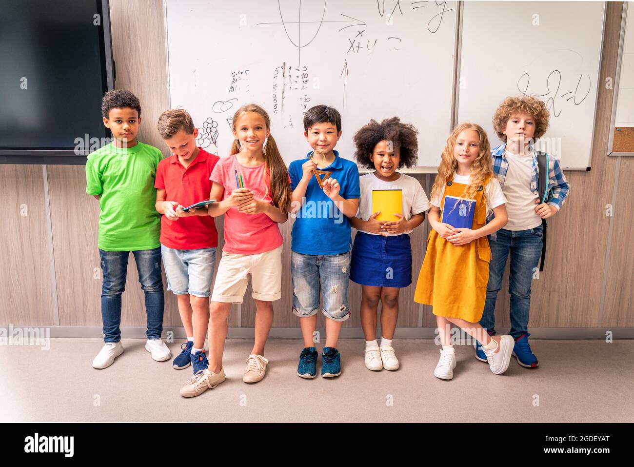 Multiracial group of kids at primary school - Playful schoolers ...