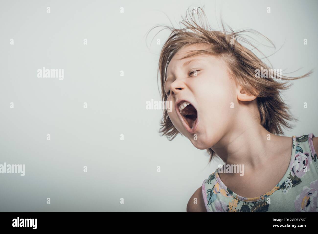 blond caucasian little girl screams.studio shot Stock Photo - Alamy