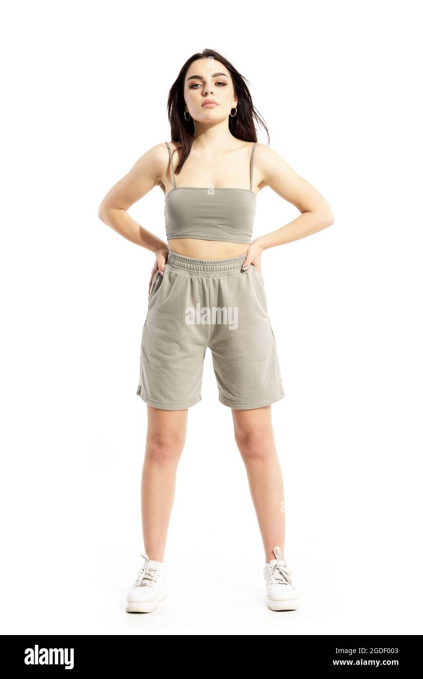 Confident cocky attitude young woman in summer clothes posing at camera ...