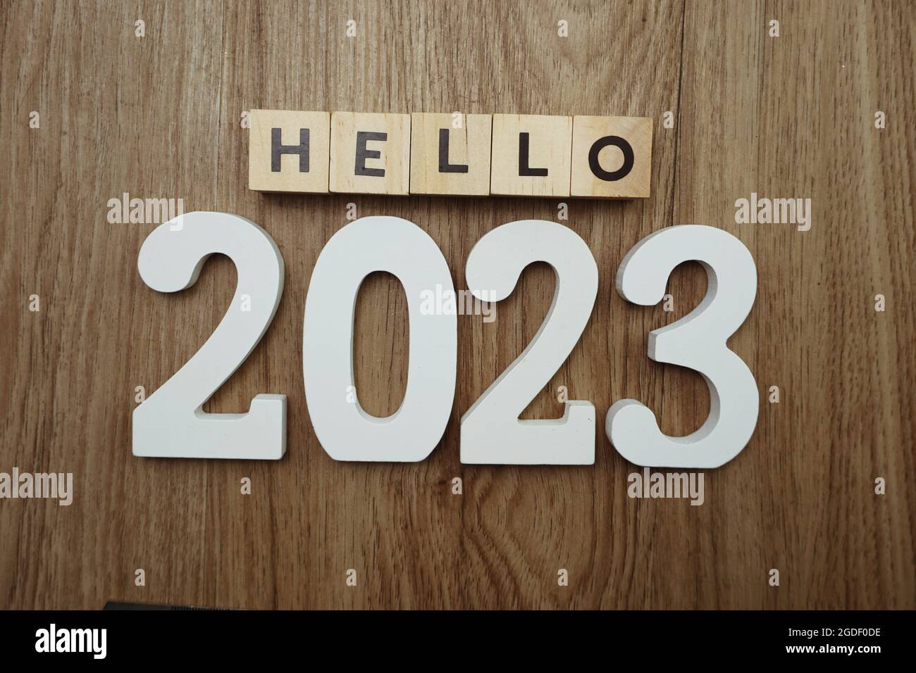 Hello 2023 word alphabet letters on wooden background Stock Photo - Alamy