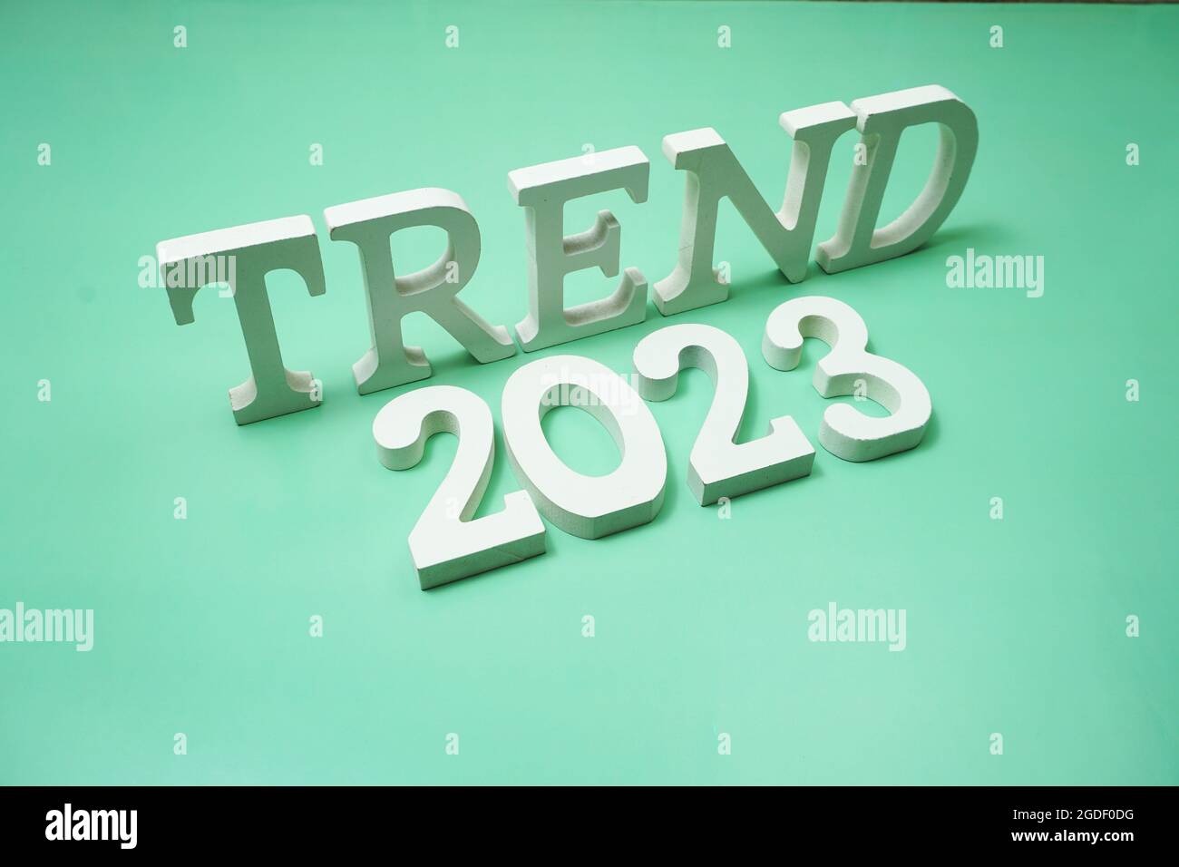 Trend 2023 alphabet letter on green background Stock Photo - Alamy