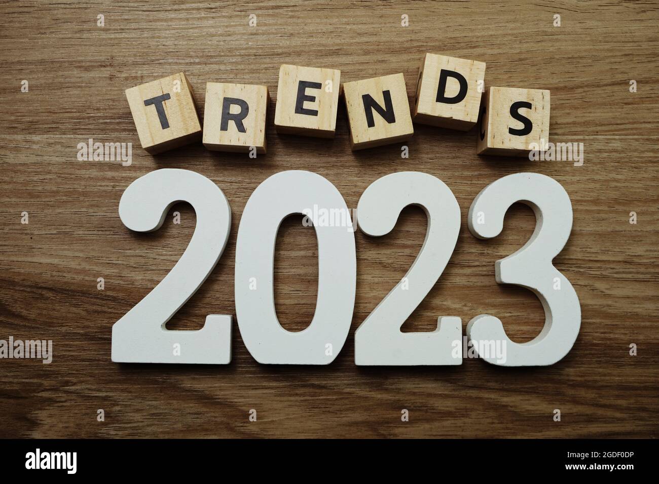 Trends 2023 word alphabet letters on wooden background Stock Photo - Alamy
