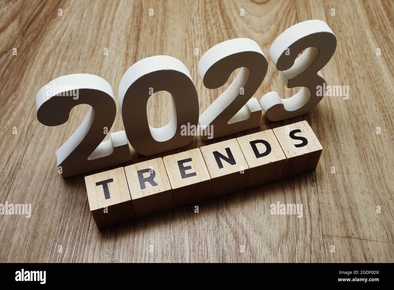 Trends 2023 word alphabet letters on wooden background Stock Photo - Alamy