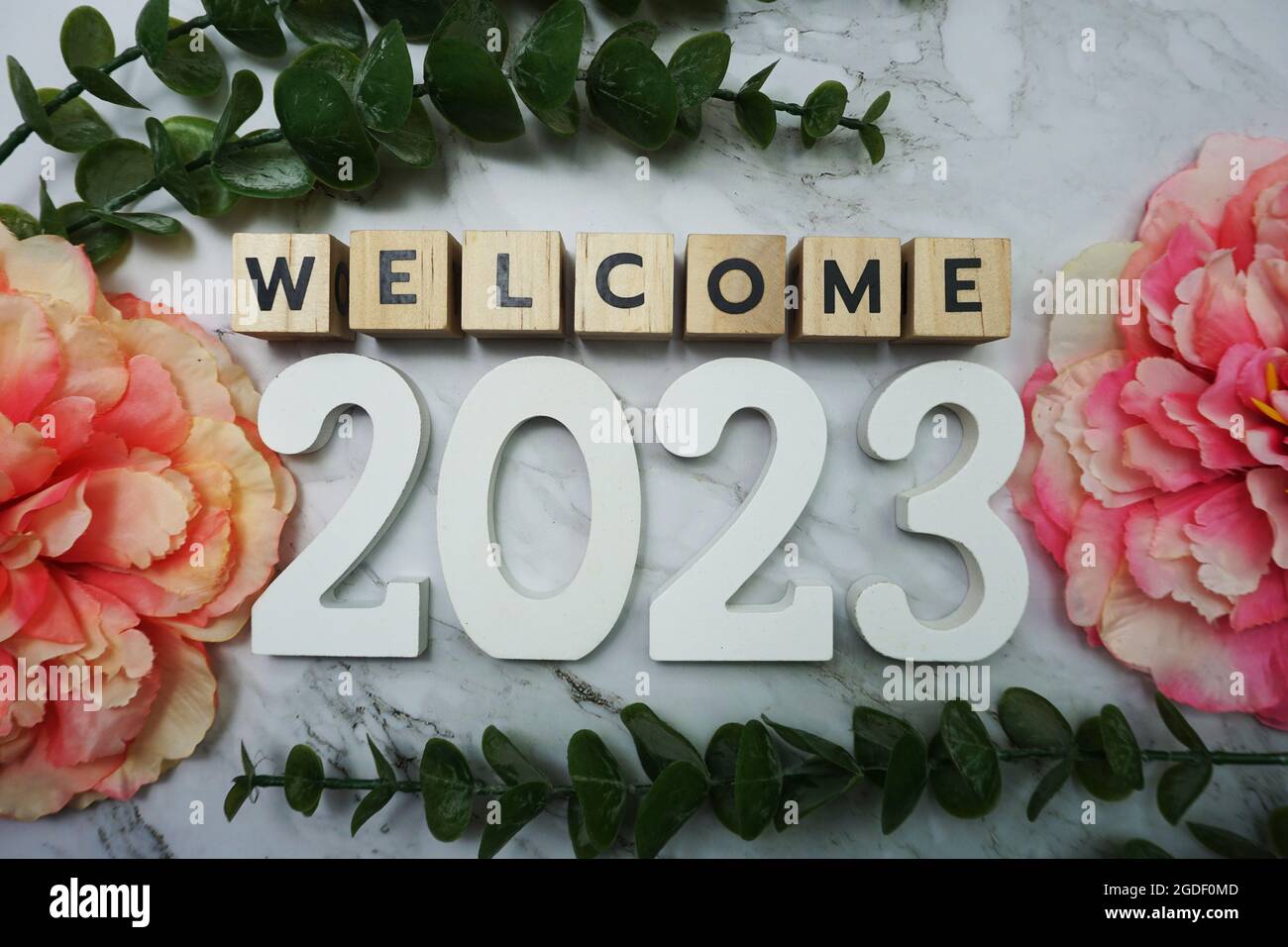 Welcome 2023 alphabet letters on marble background Stock Photo - Alamy