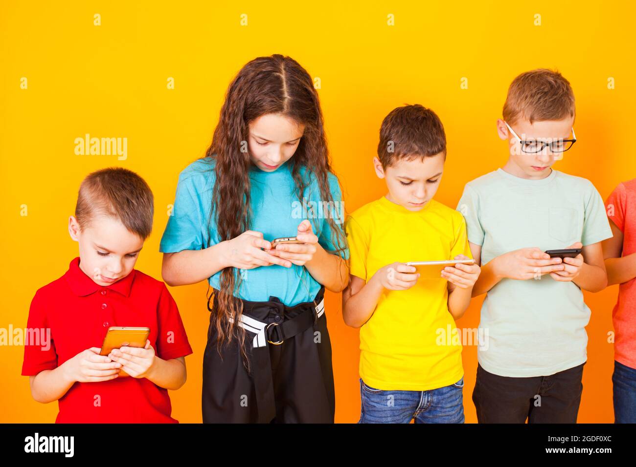 Young kids playing game on mobile phone Stock Photo - Alamy