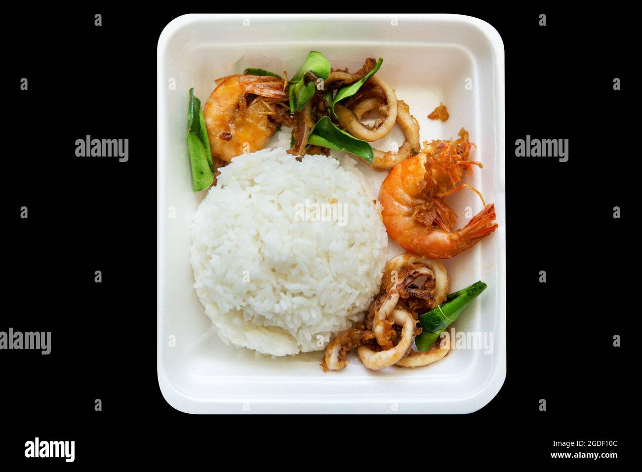 Fast food Squid and shrimp garlic and pepper with rice on black ...