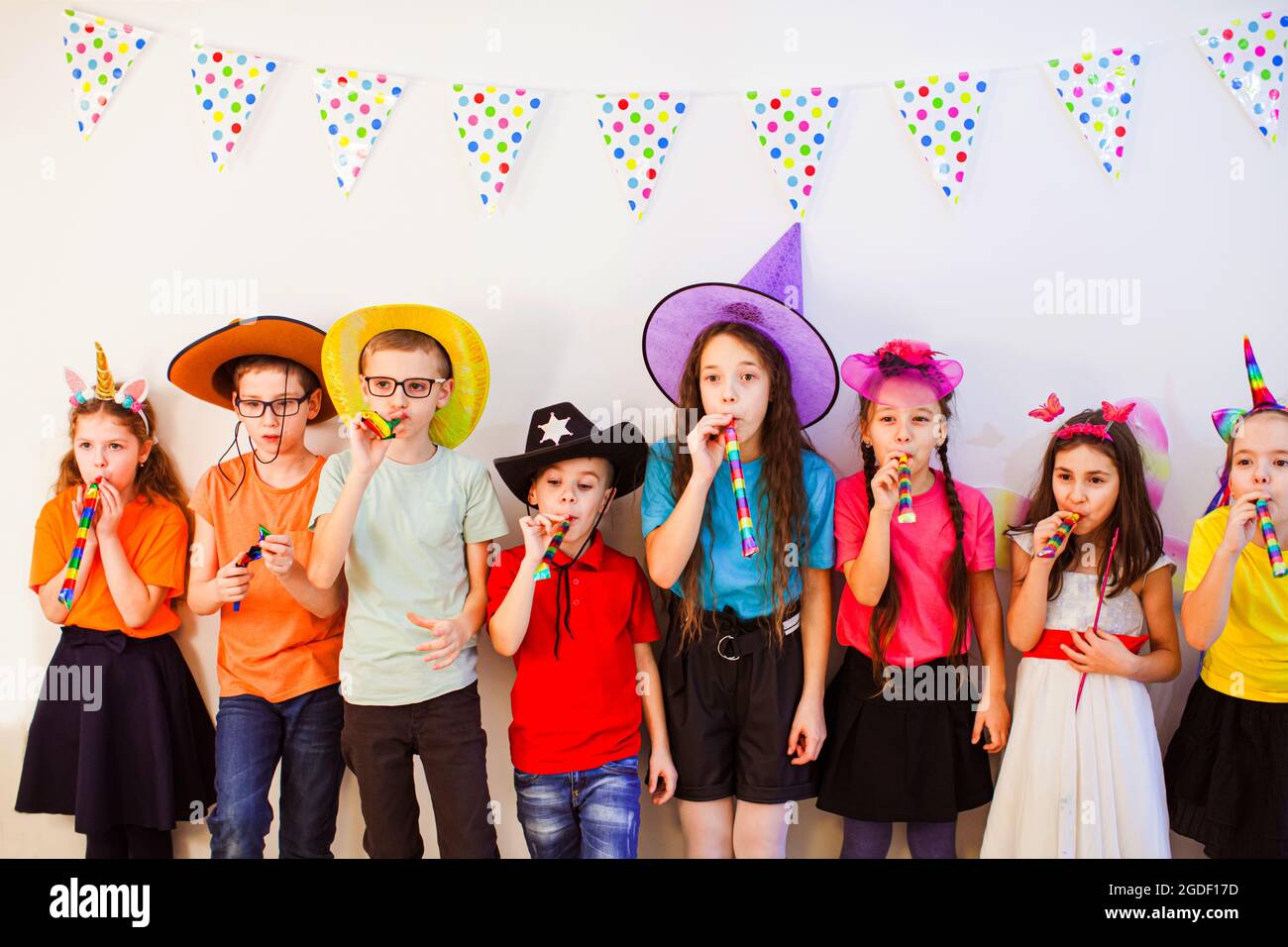 Cheerful kids having good time at Birthday party Stock Photo - Alamy