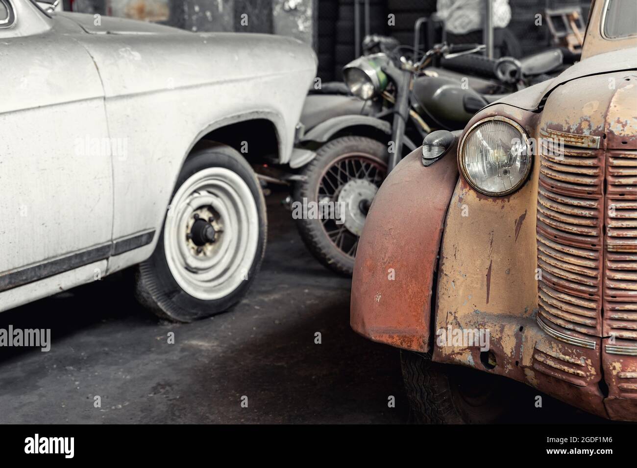 Many rusty abandoned forgotten antique oldtimer old car and motorcycles ...