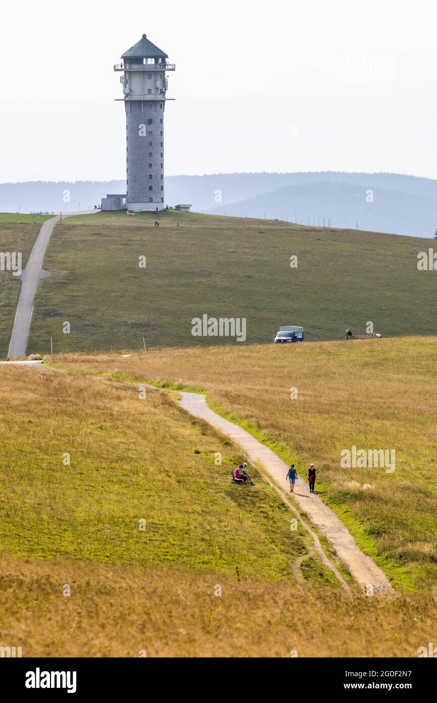 Feldberg, Germany. 13th Aug, 2021. Tourists walk along a path near the ...