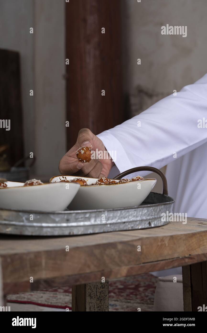 Man eating emirates traditional food at the table Stock Photo - Alamy