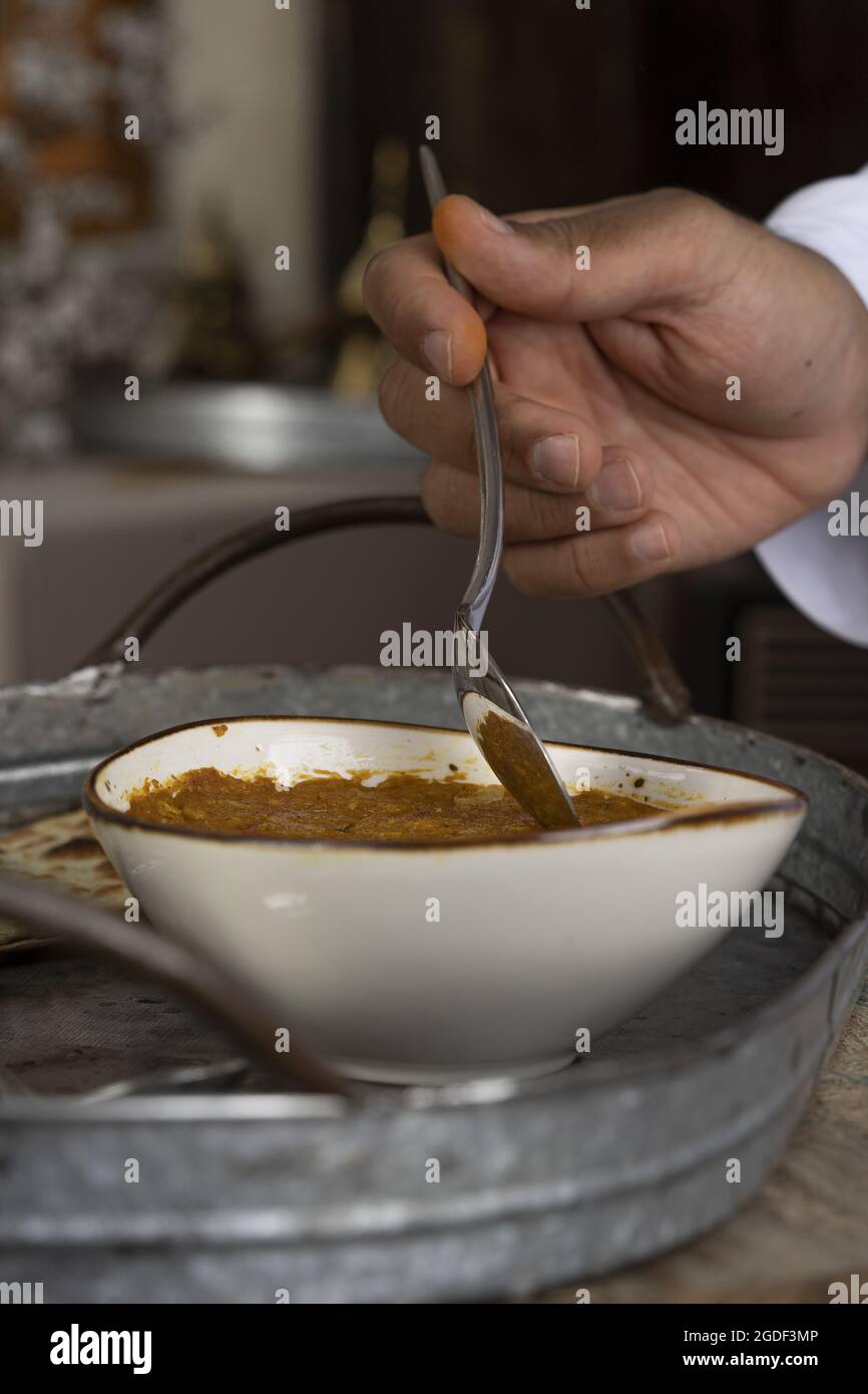 Man eating emirates traditional food at the table Stock Photo - Alamy