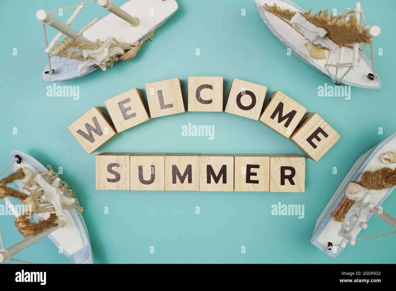 Welcome Summer message alphabet letter with sailboat on blue background ...
