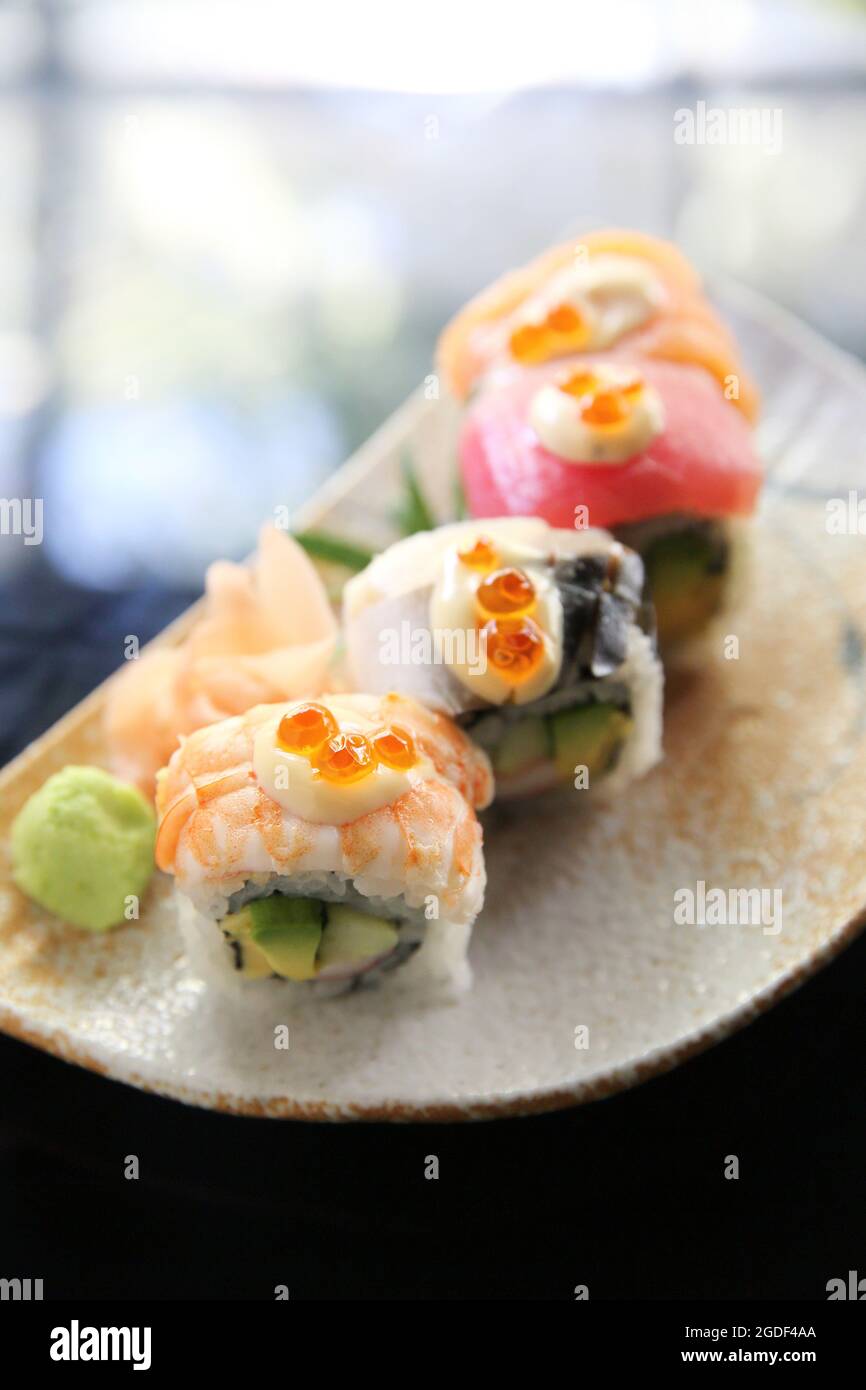 Mix maki sushi roll japanese food in black background Stock Photo - Alamy
