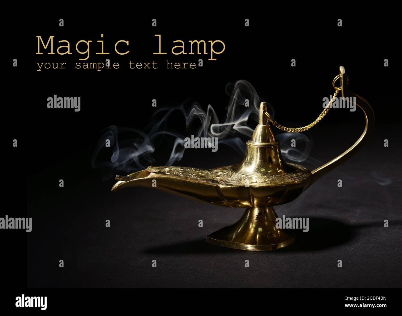 Magic lamp isolated on black Stock Photo - Alamy