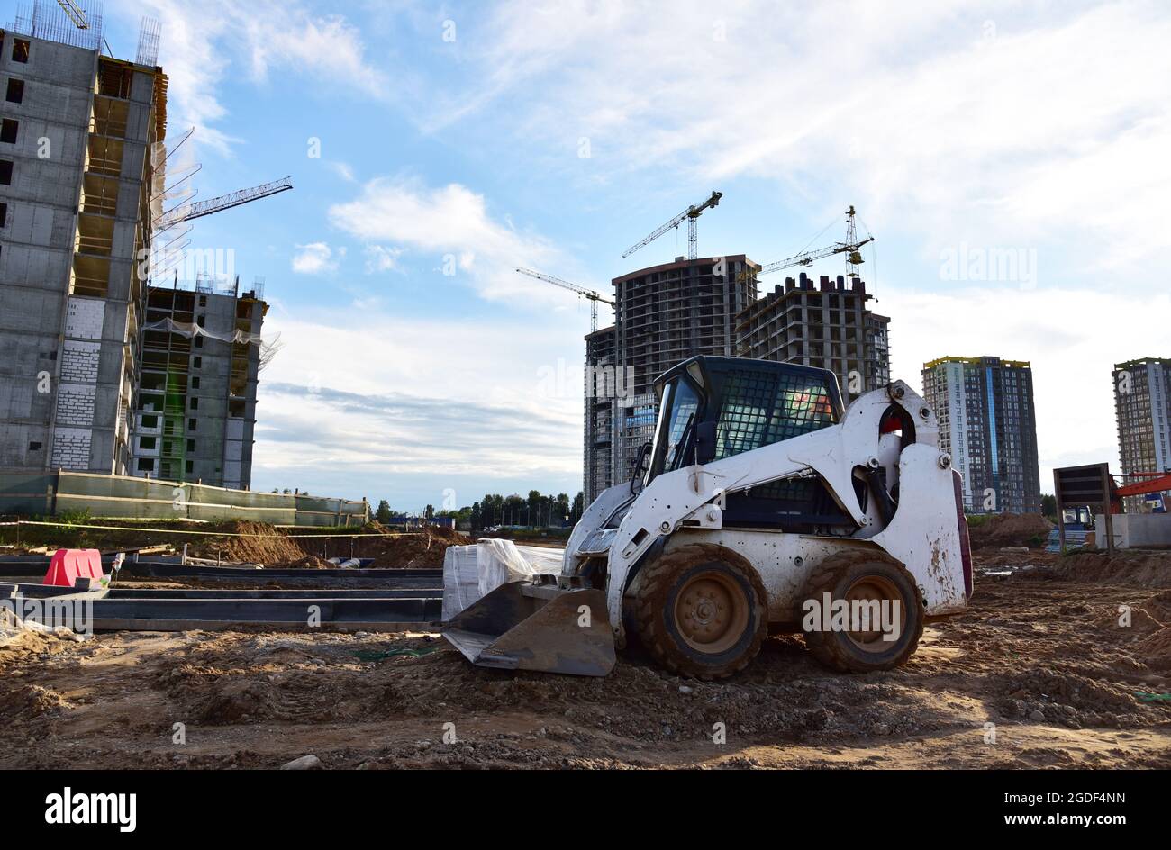 Skid-steer loader for loading and unloading works on city streets ...