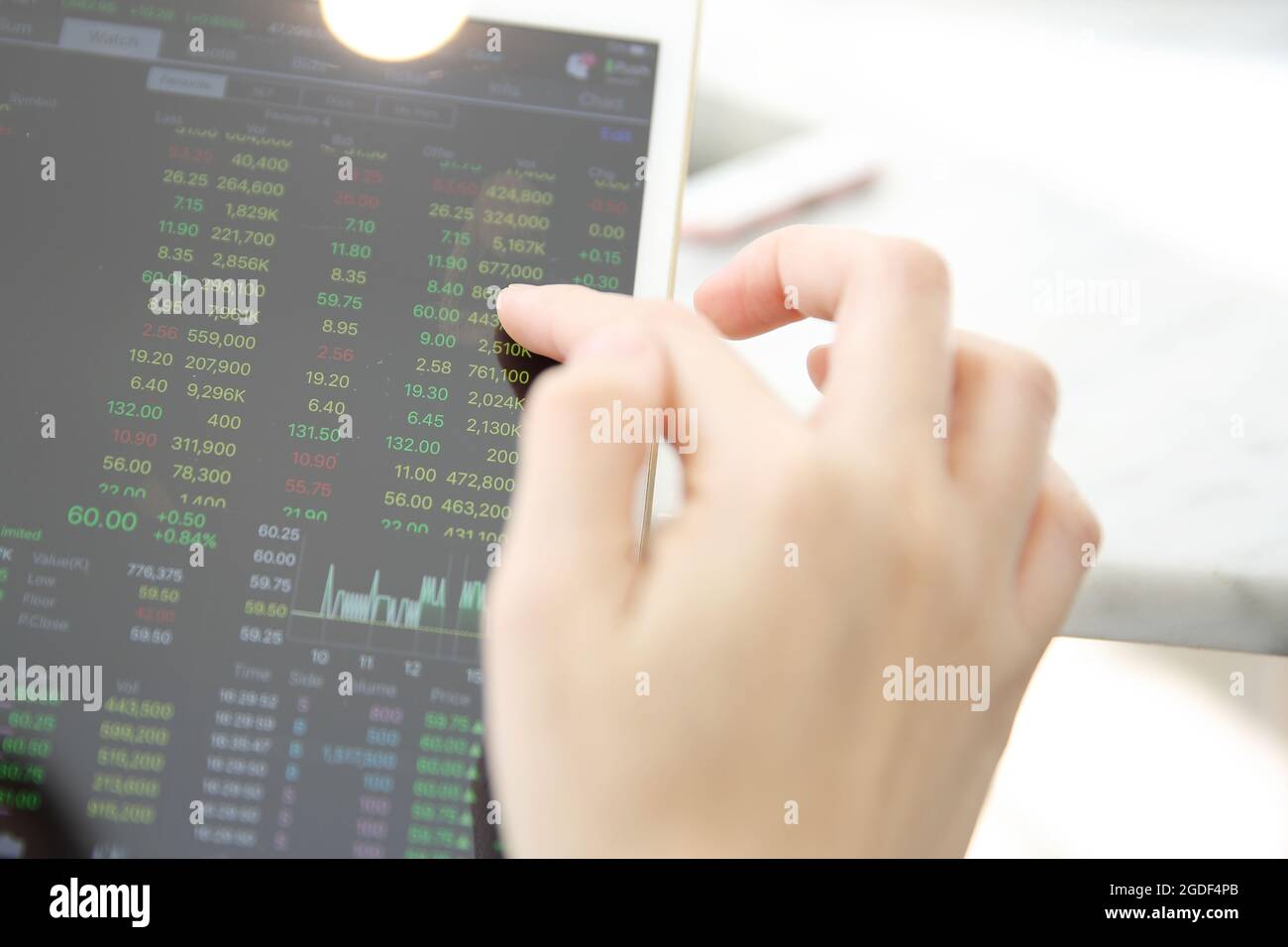 Making trading online on the tablet with business woman hand Stock ...